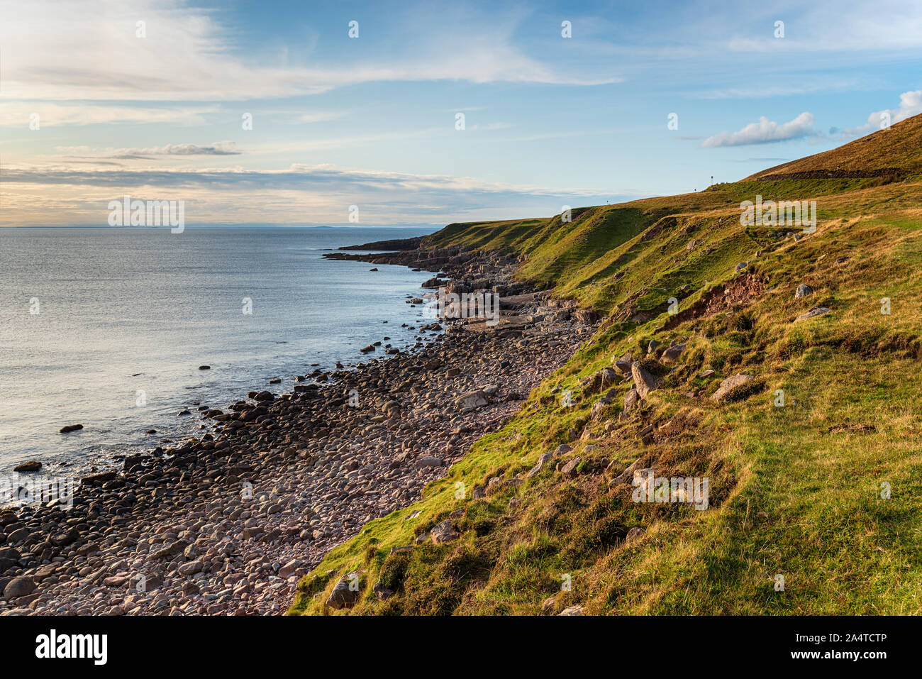 The beach and grassy cliffs at Raffin on the foot of Stoer Head in the ...