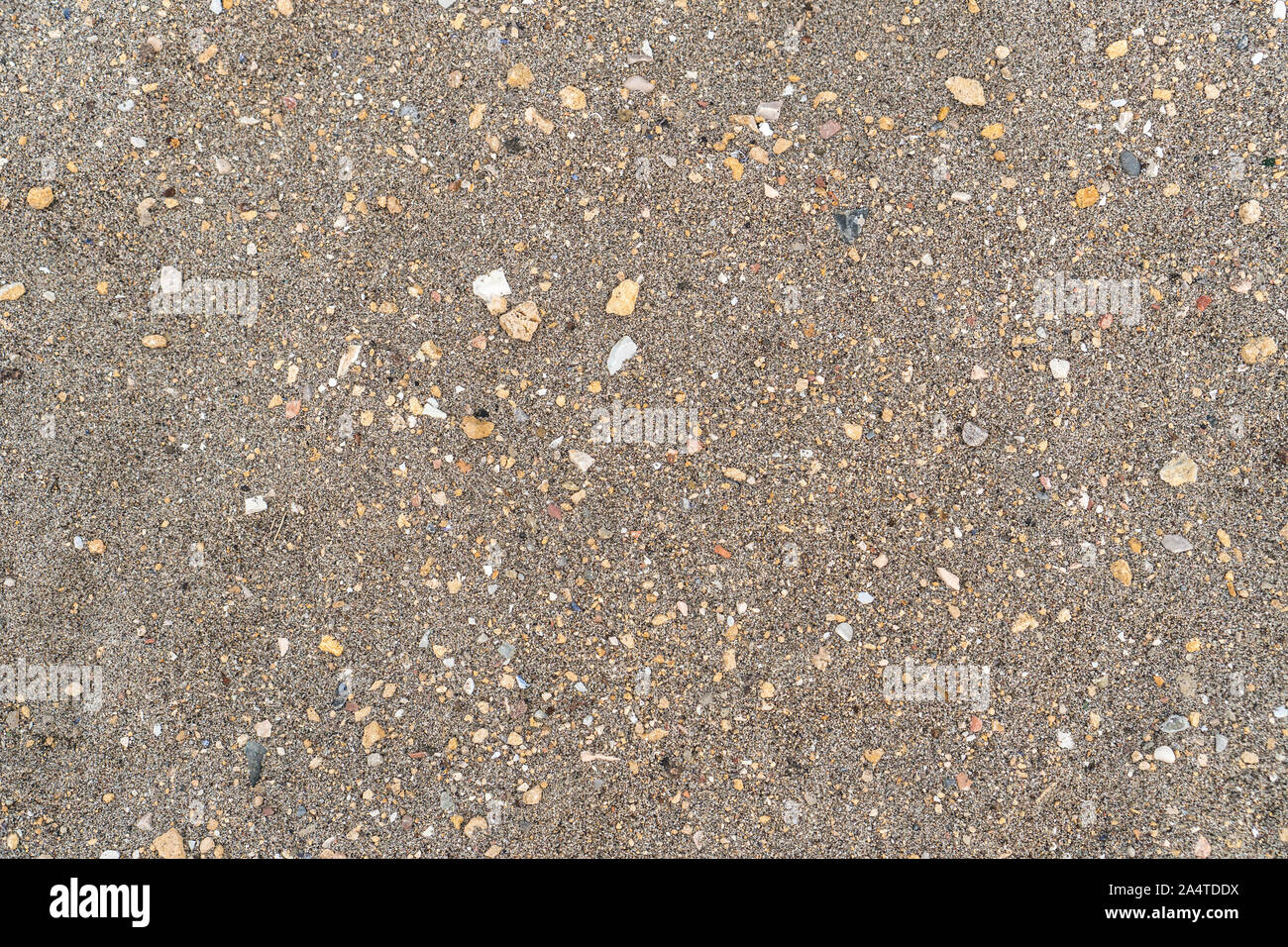 Texture of beach sand with small pebbles Stock Photo - Alamy