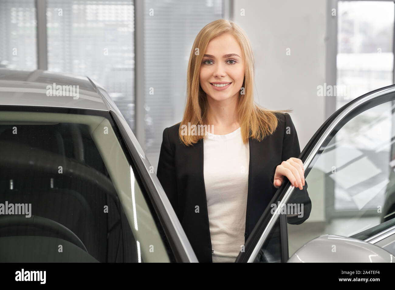 Female model posing car hi-res stock photography and images - Alamy