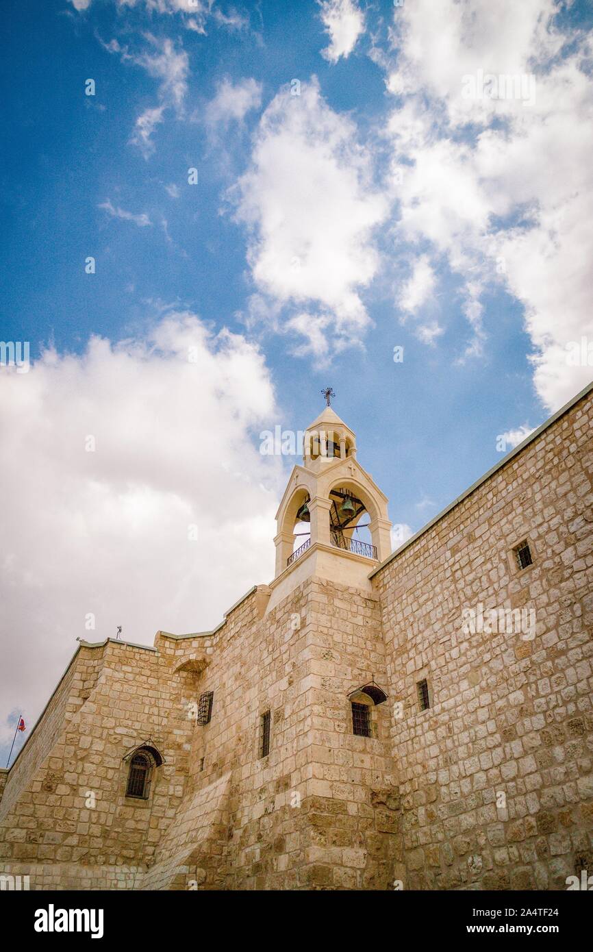 Church of the Nativity. Bell tower and beautiful cloudy sky. Details ...