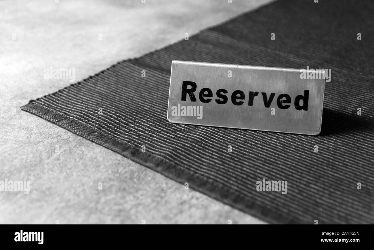 Reserved table sign in restaurant, silver reserved plate, black and ...
