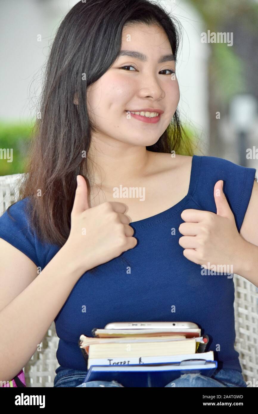 Young chinese female student thumbs hi-res stock photography and images ...