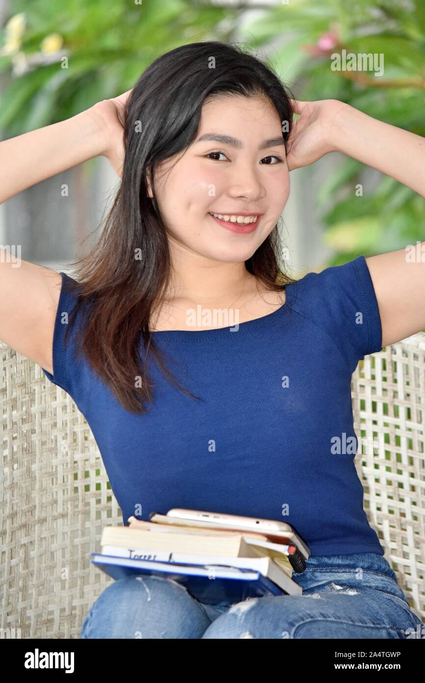 Chinese Female Student Relaxing Stock Photo - Alamy