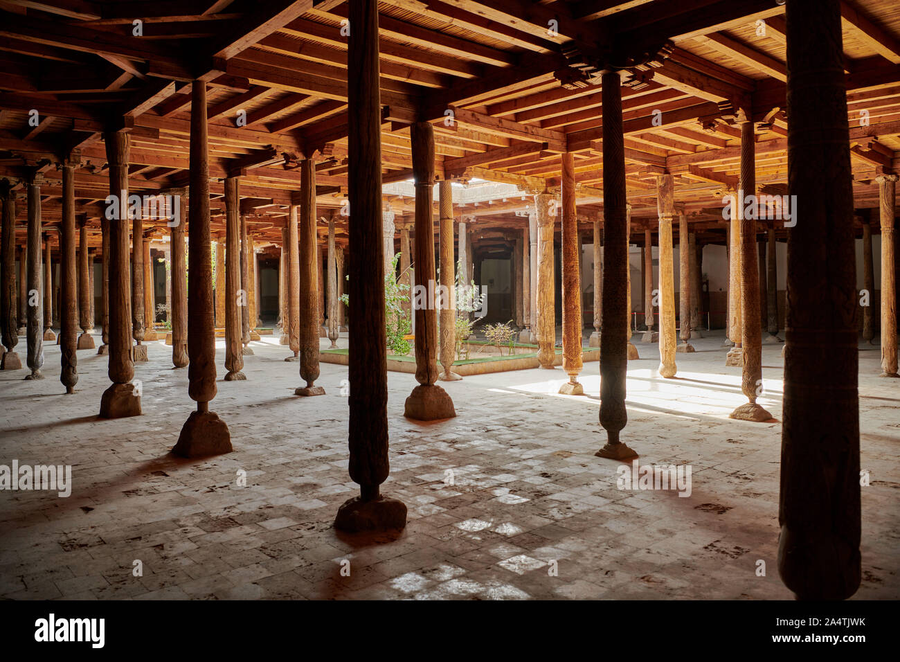 old carved wooden columns in Djuma Mosque old town Khiva, Itchan-Kala ...