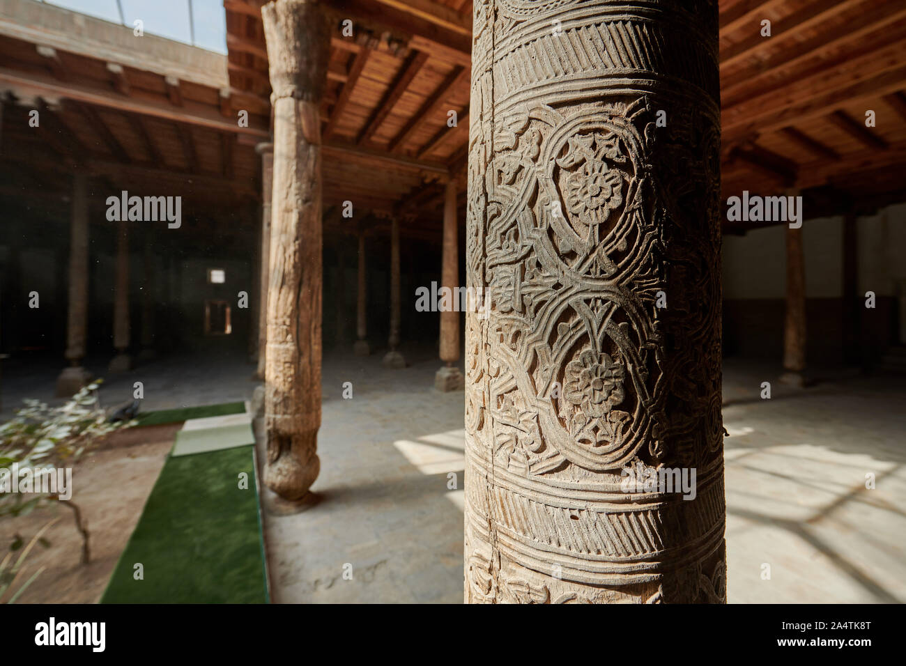 old carved wooden columns in Djuma Mosque old town Khiva, Itchan-Kala ...