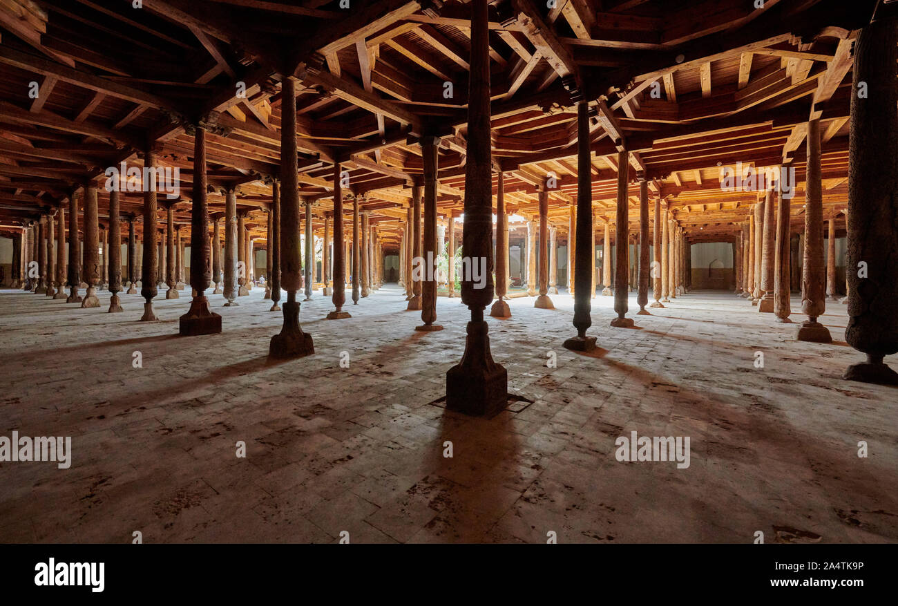 old carved wooden columns in Djuma Mosque old town Khiva, Itchan-Kala ...