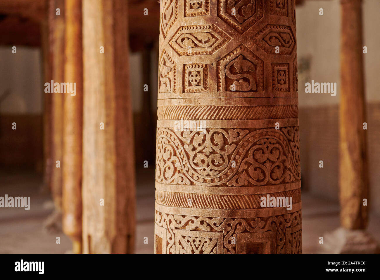 old carved wooden columns in Djuma Mosque old town Khiva, Itchan-Kala ...