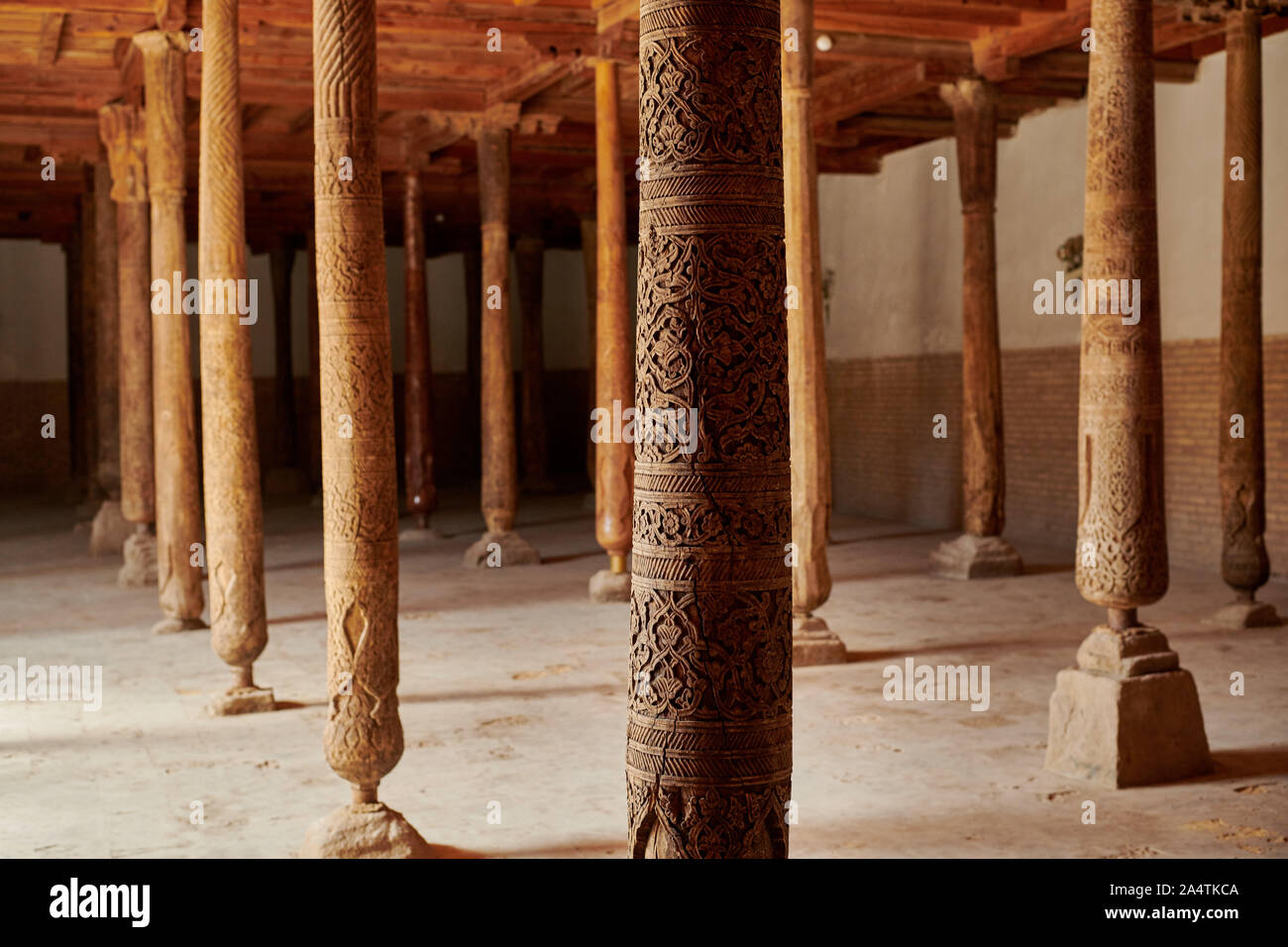 old carved wooden columns in Djuma Mosque old town Khiva, Itchan-Kala ...