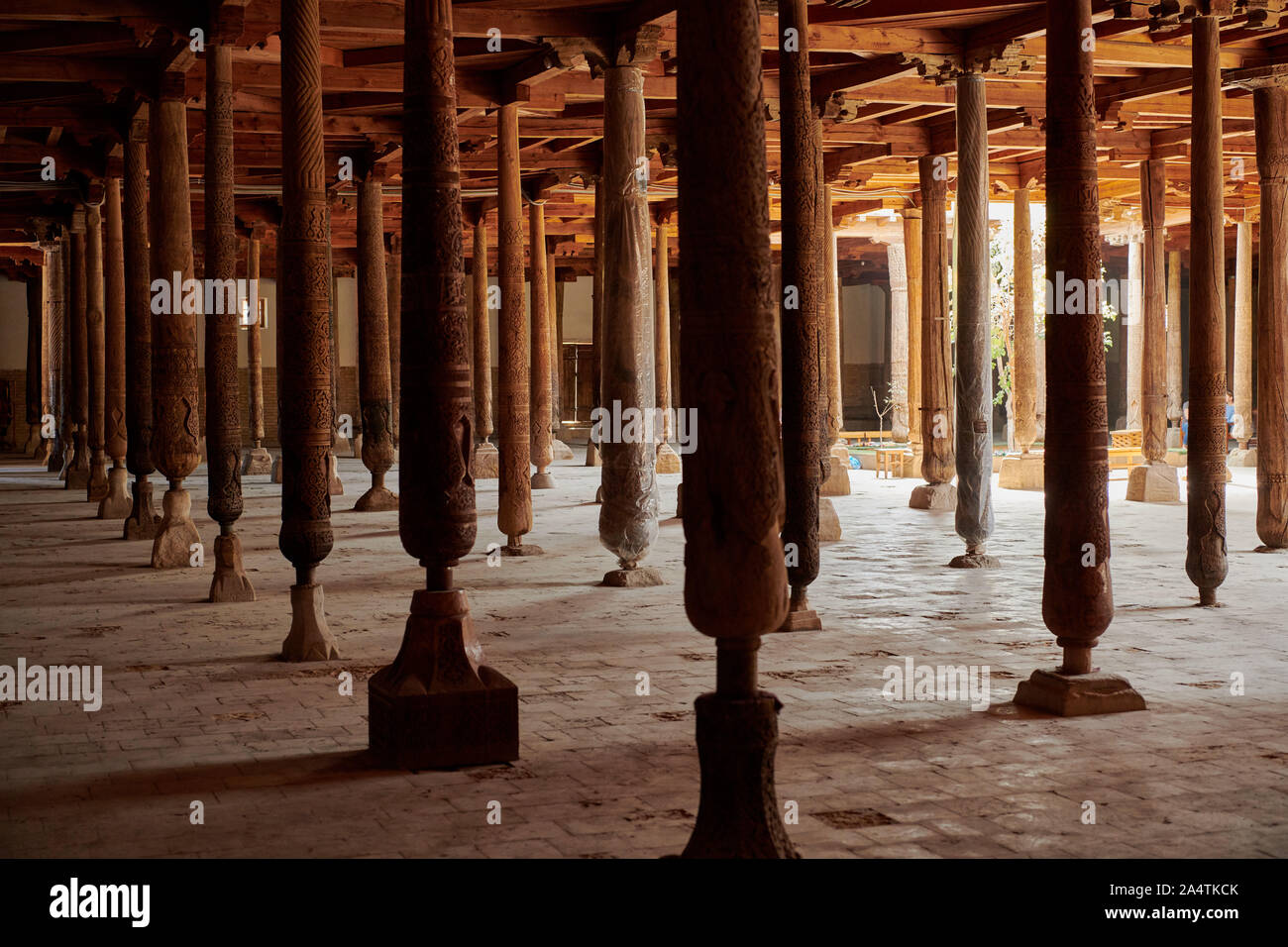old carved wooden columns in Djuma Mosque old town Khiva, Itchan-Kala ...