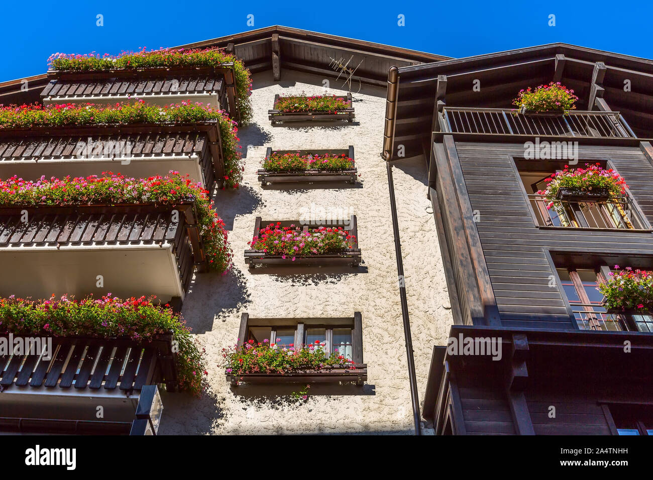 House decorated with flowers in Zermatt, alpine village, Switzerland ...