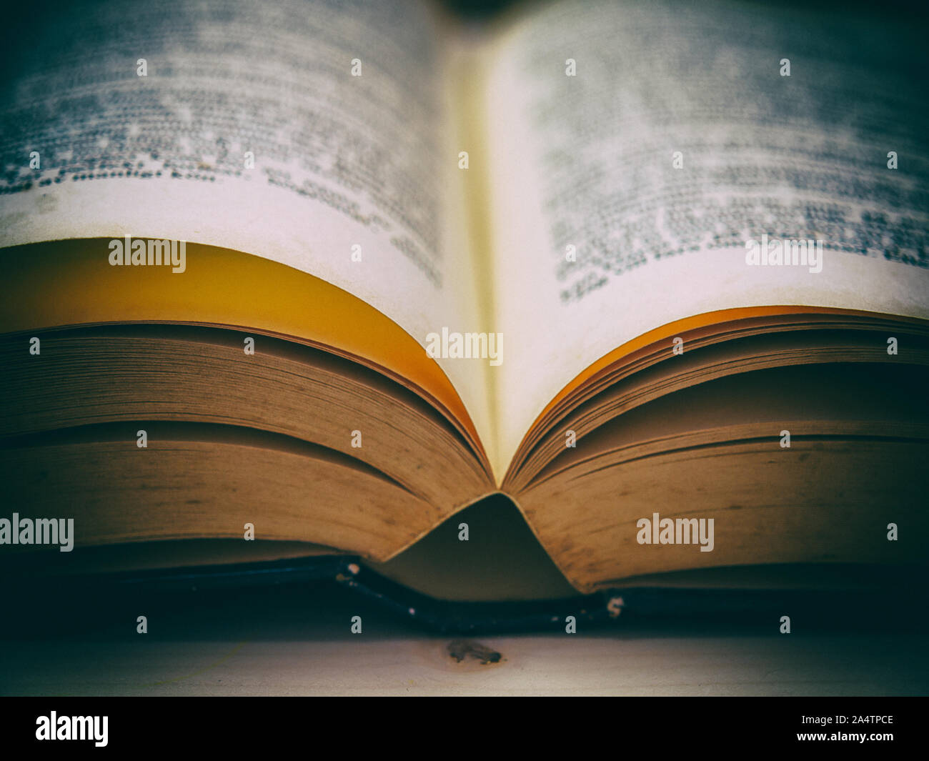 Open book on a wooden table , Vintage old books Stock Photo - Alamy