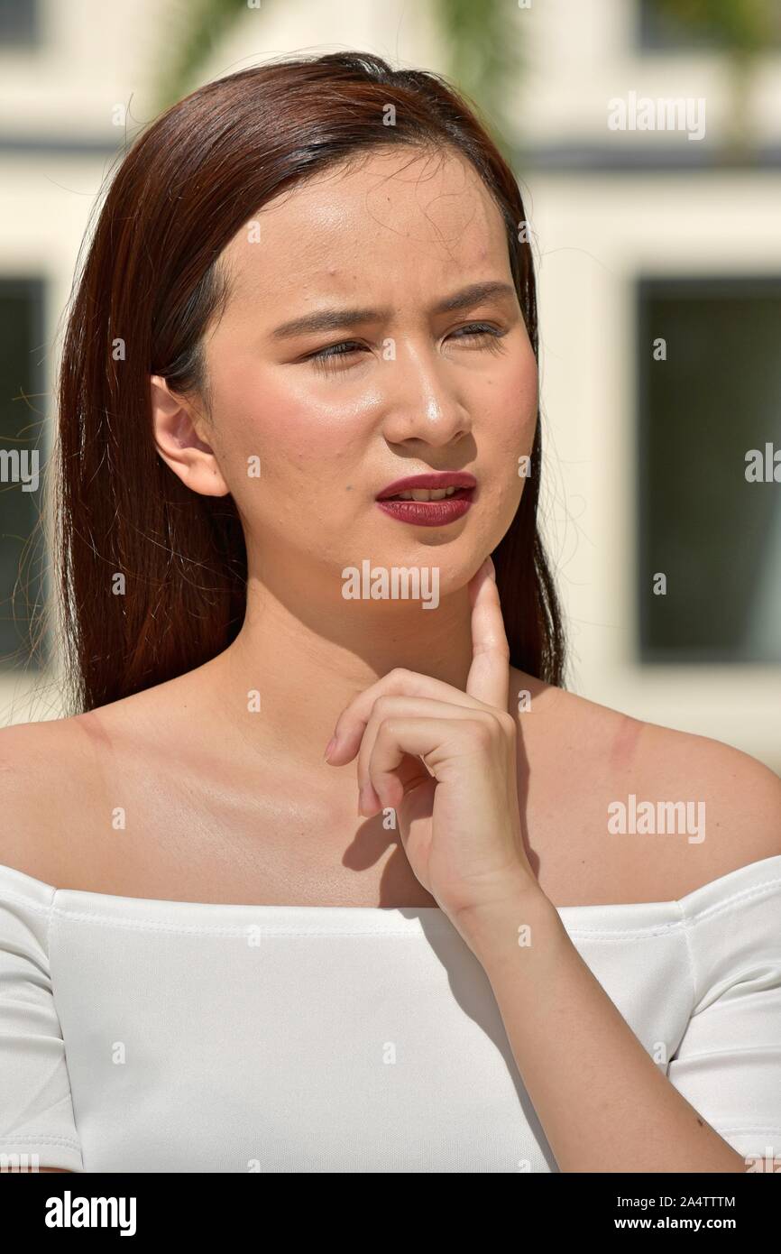 Asian Adult Female Making A Decision Stock Photo - Alamy