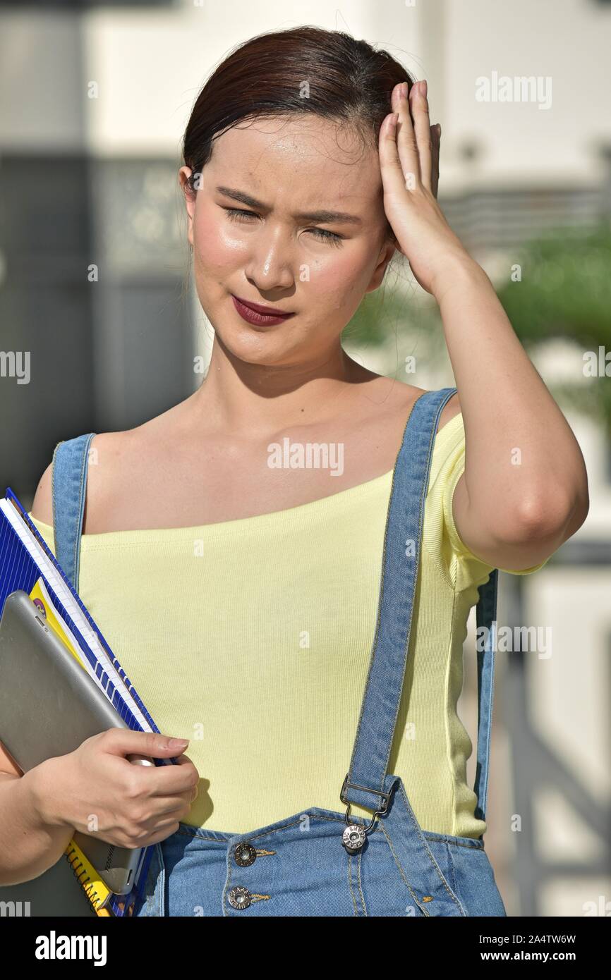 Youthful Asian Girl Student And Memory Loss Stock Photo - Alamy