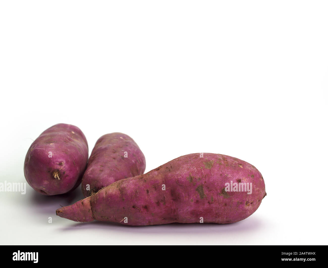 Fresh yams , isolated on a white background Stock Photo - Alamy