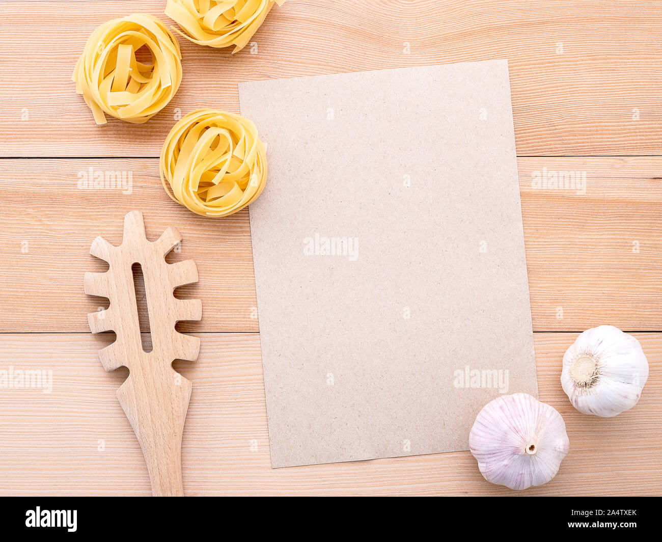 Italian foods concept and menu design . Blank paper and pasta ladle on ...