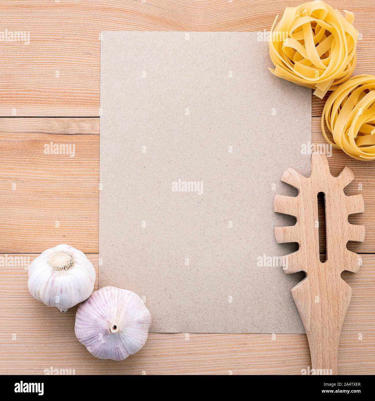 Italian foods concept and menu design . Blank paper and pasta ladle on ...
