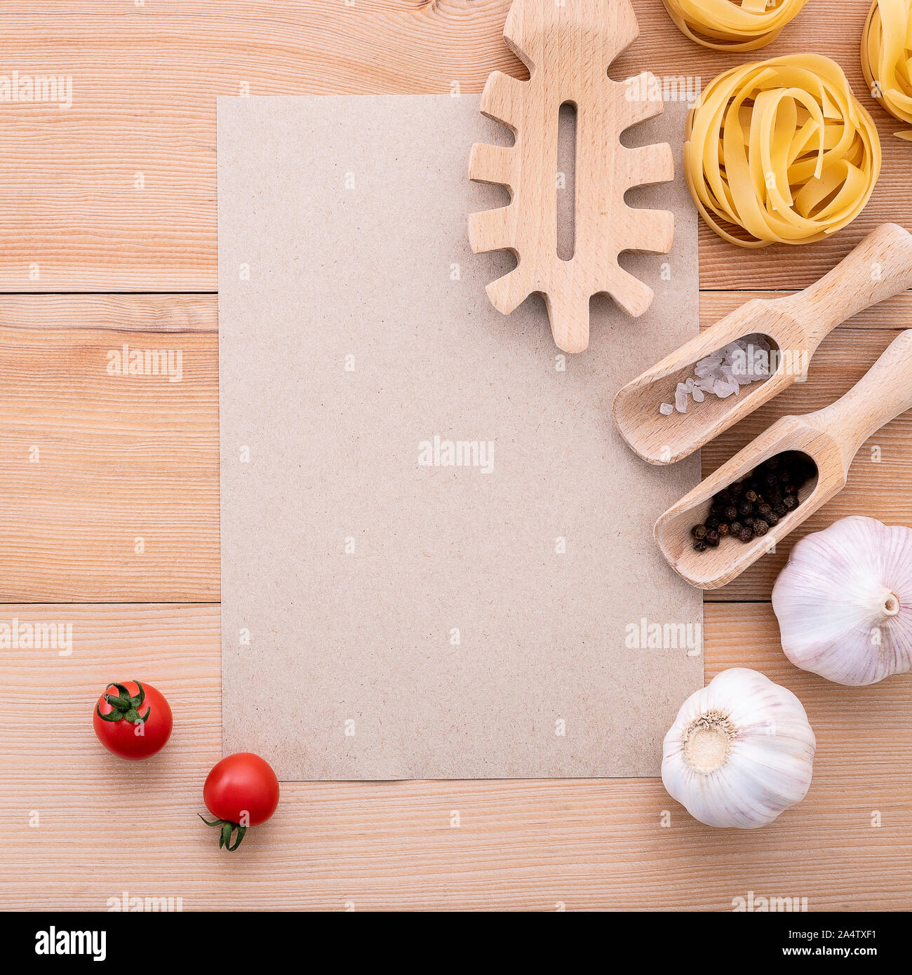 Italian foods concept and menu design . Blank paper and pasta ladle on ...