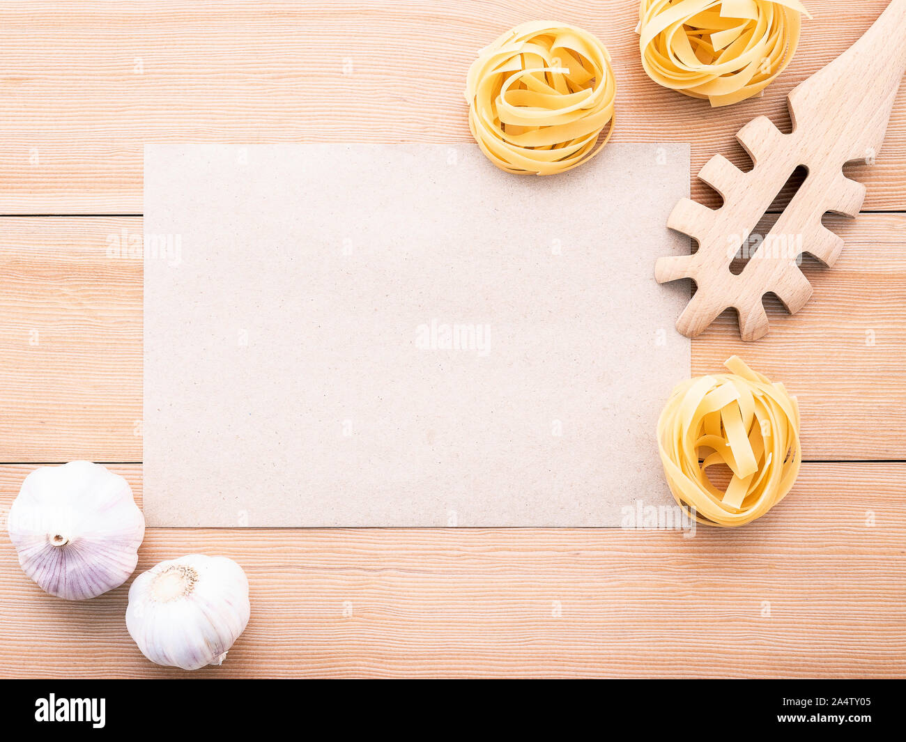 Italian foods concept and menu design . Blank paper and pasta ladle on ...