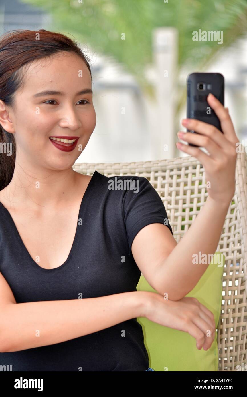 Female Using Cell Phone And Happy Stock Photo - Alamy