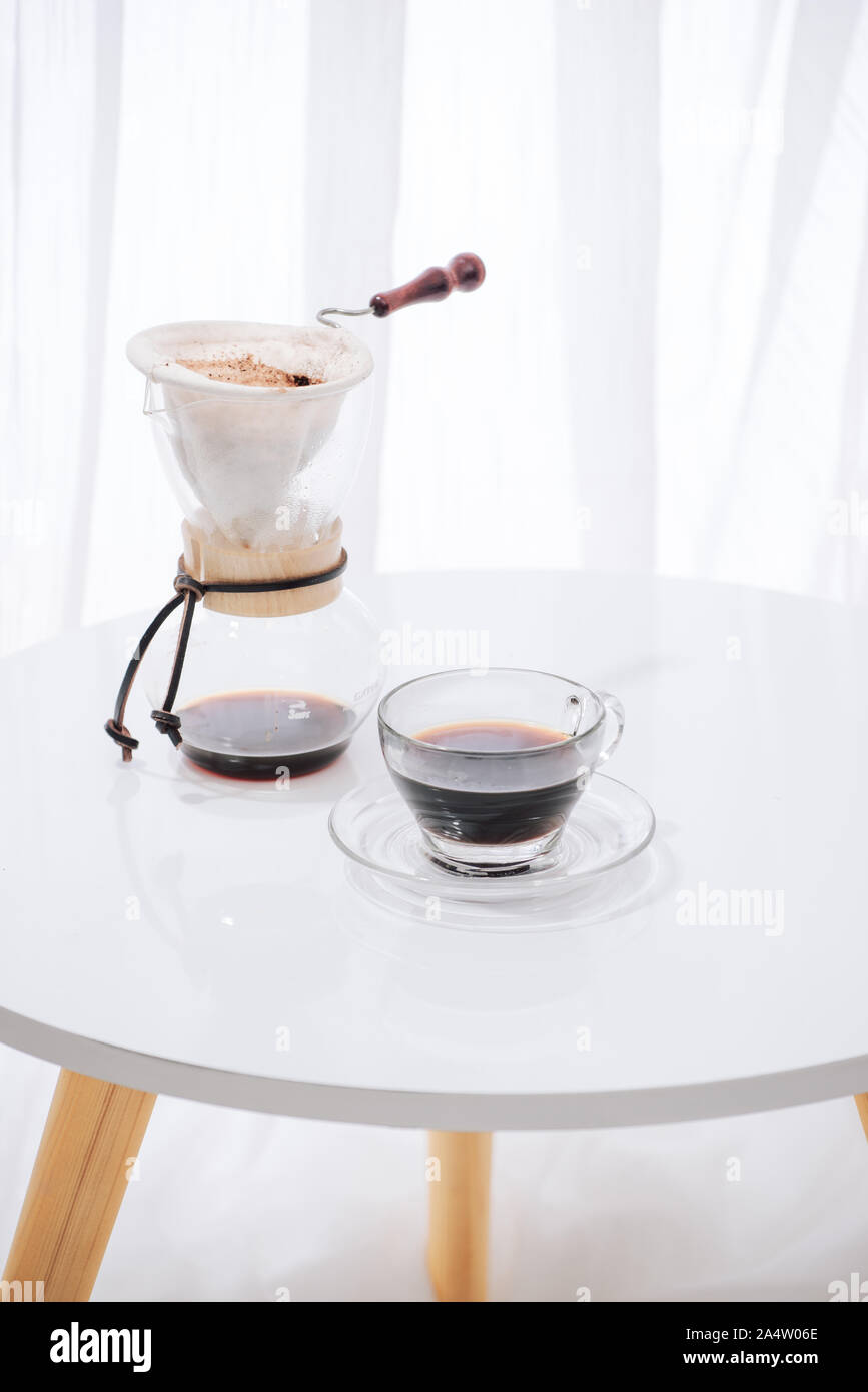 Pour over drip process coffee in retro filter effect with copy space ...