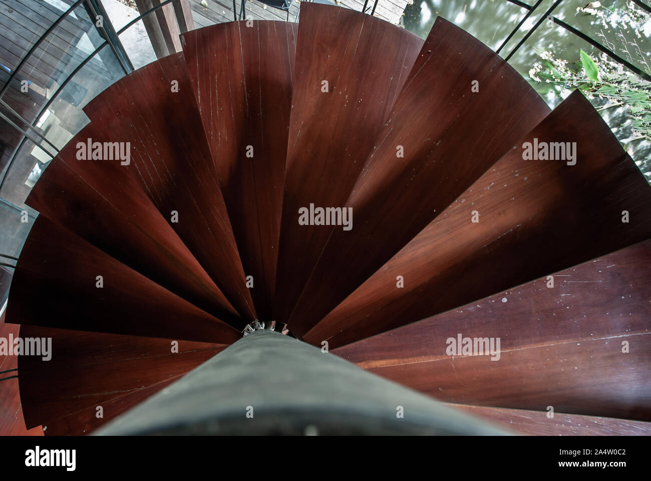 Upside view of a wooden spiral staircase, interior architecture of ...