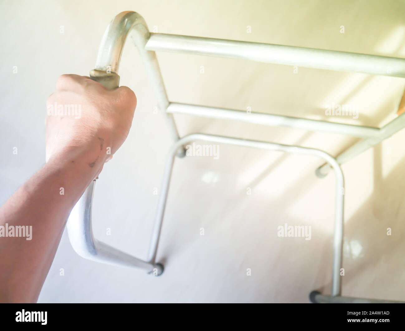 left hand grips the walking aids, Medical equipment For patients who ...