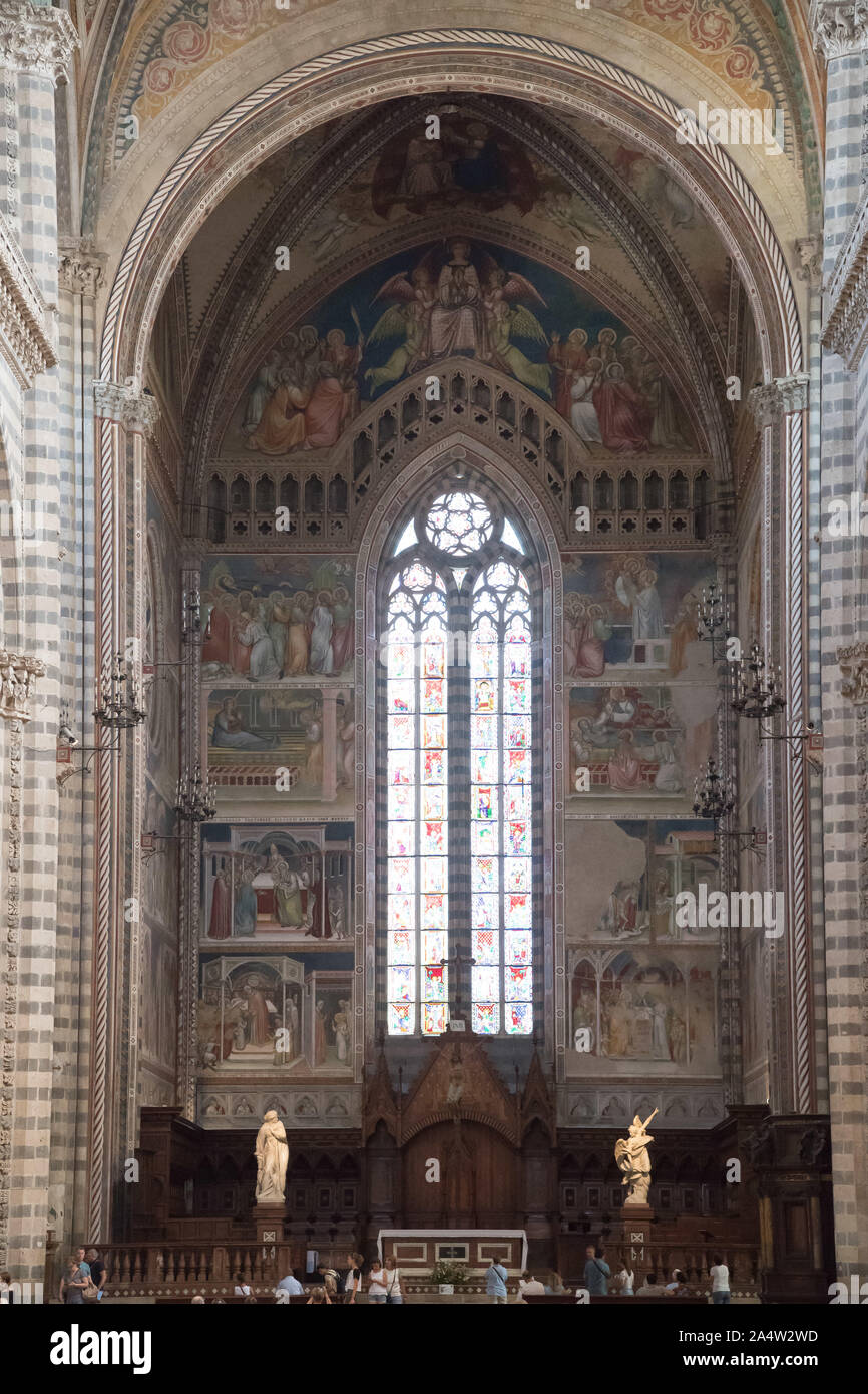 Gothic stained-glass quadrifore window and Gothic frescoes dedicated to ...