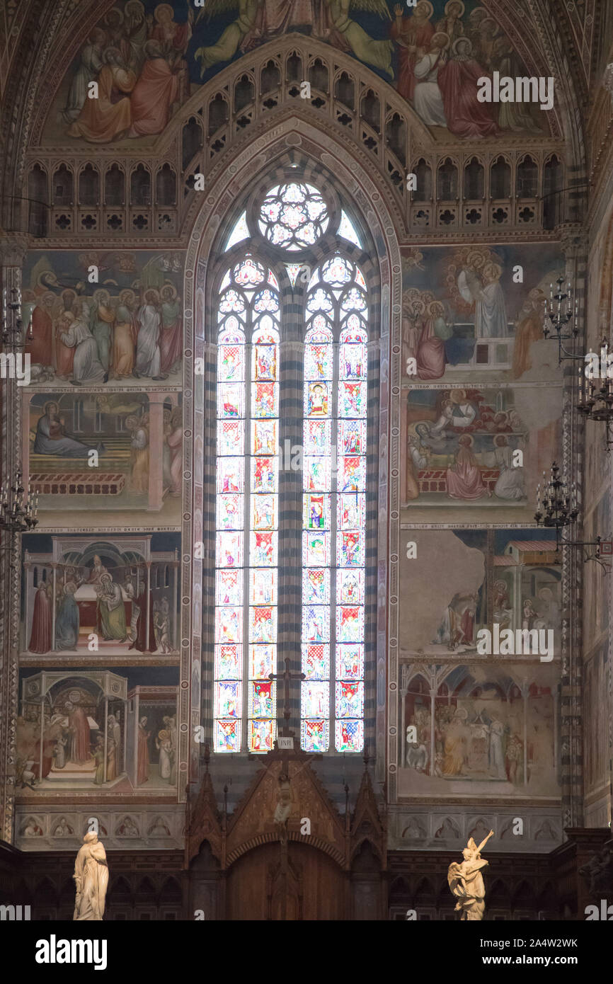 Gothic stained-glass quadrifore window and Gothic frescoes dedicated to ...