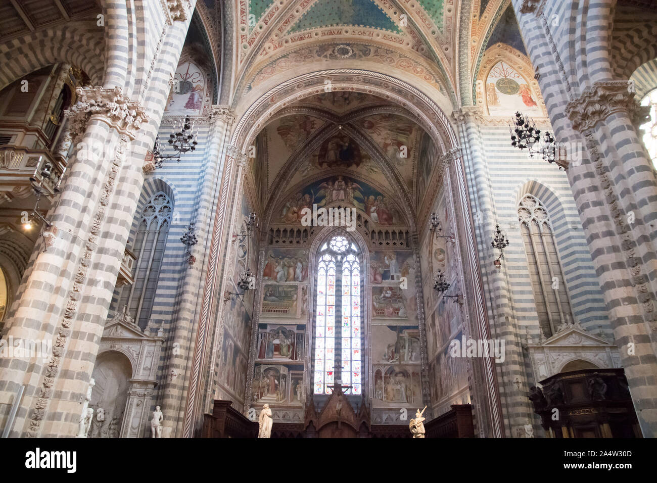 Gothic stained-glass quadrifore window and Gothic frescoes dedicated to ...