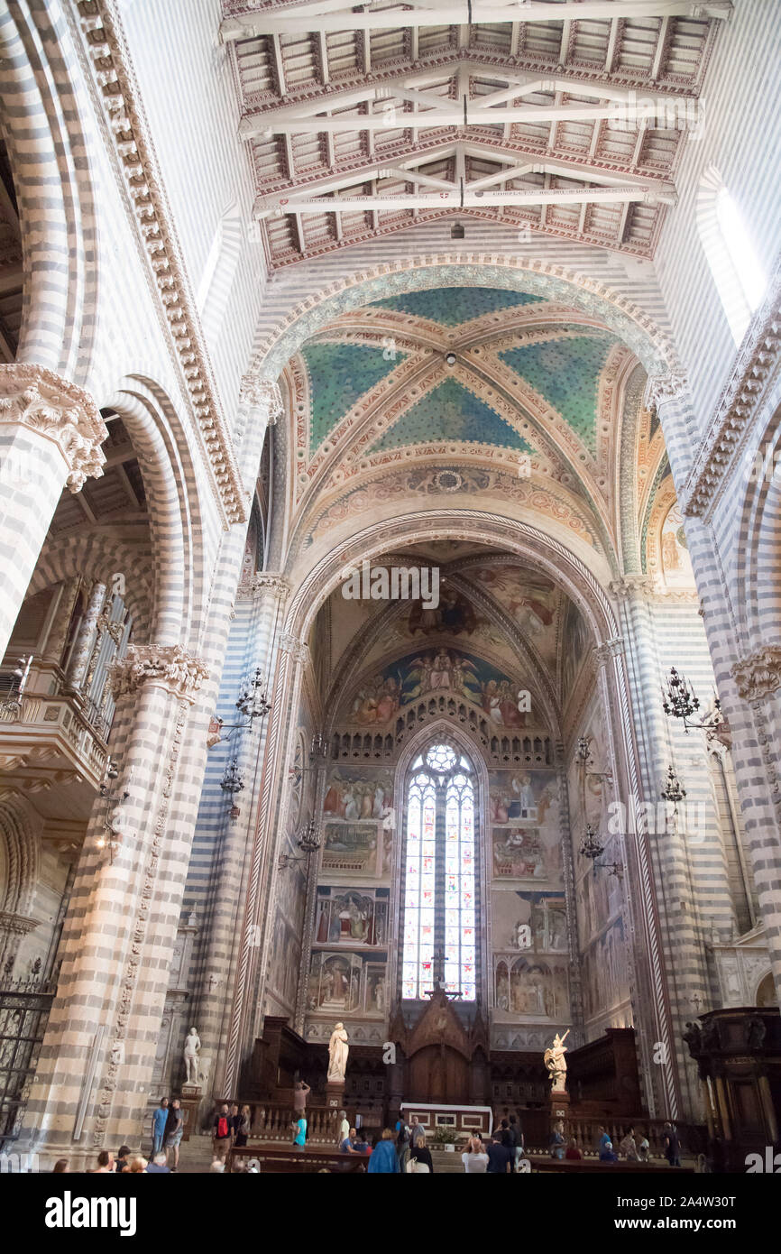 Gothic stained-glass quadrifore window and Gothic frescoes dedicated to ...