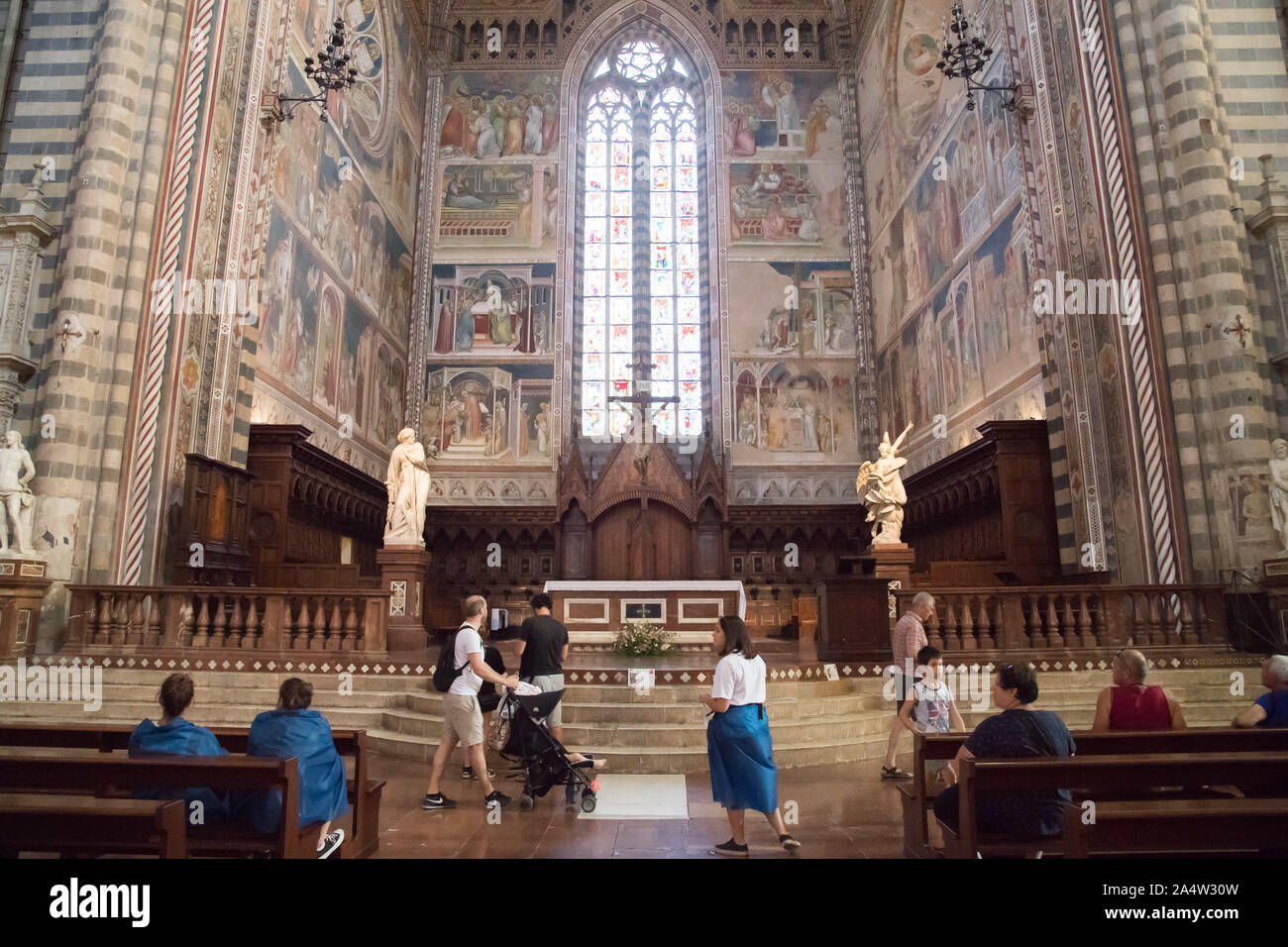 Gothic stained-glass quadrifore window and Gothic frescoes dedicated to ...