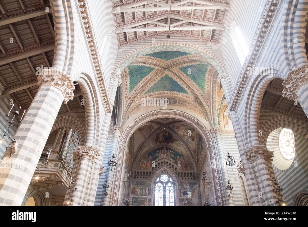 Gothic stained-glass quadrifore window and Gothic frescoes dedicated to ...