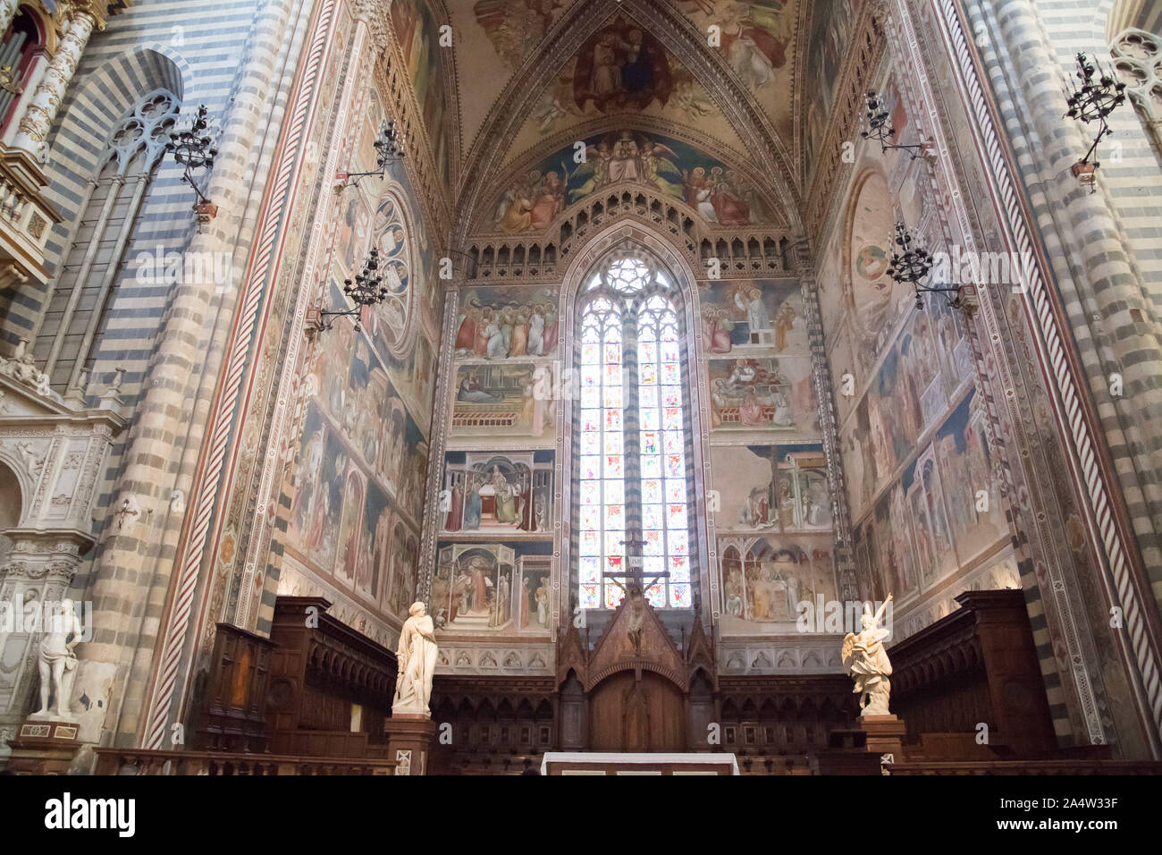 Gothic stained-glass quadrifore window and Gothic frescoes dedicated to ...