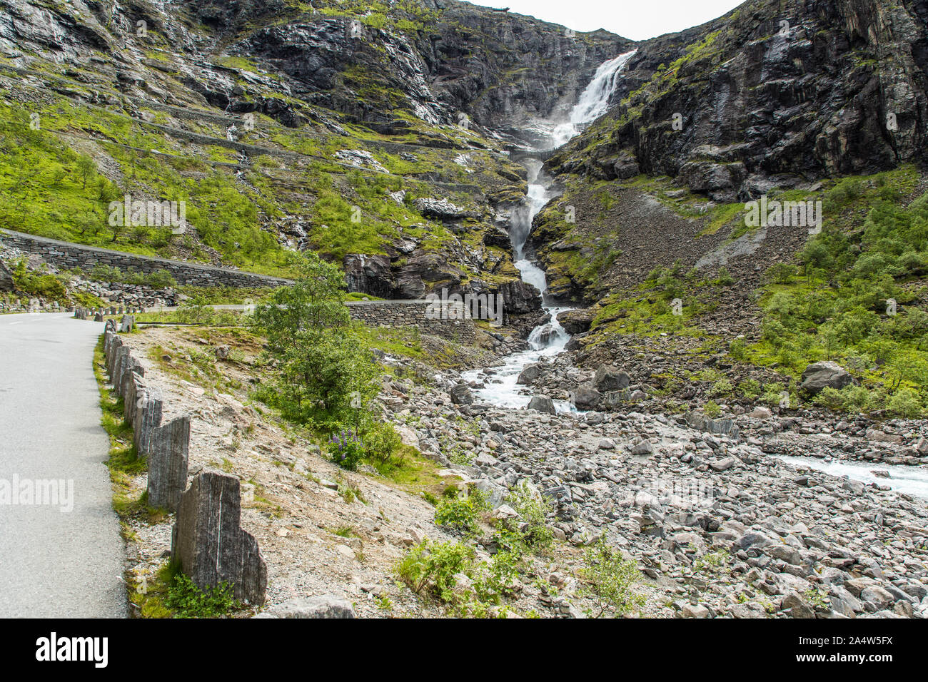 Norwegian mountain road. Trollstigen. Stigfossen waterfall. Midnight ...