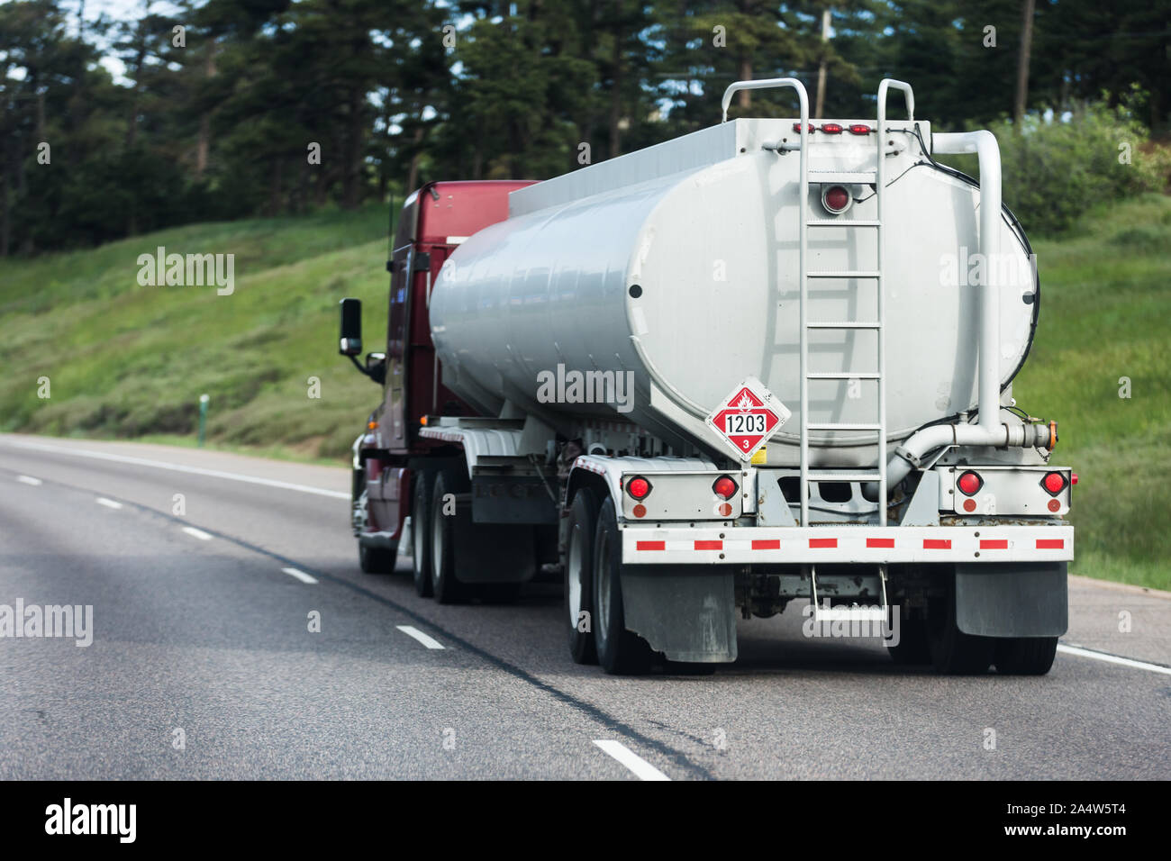 Large truck transports liquid cargo on american highway Stock Photo - Alamy