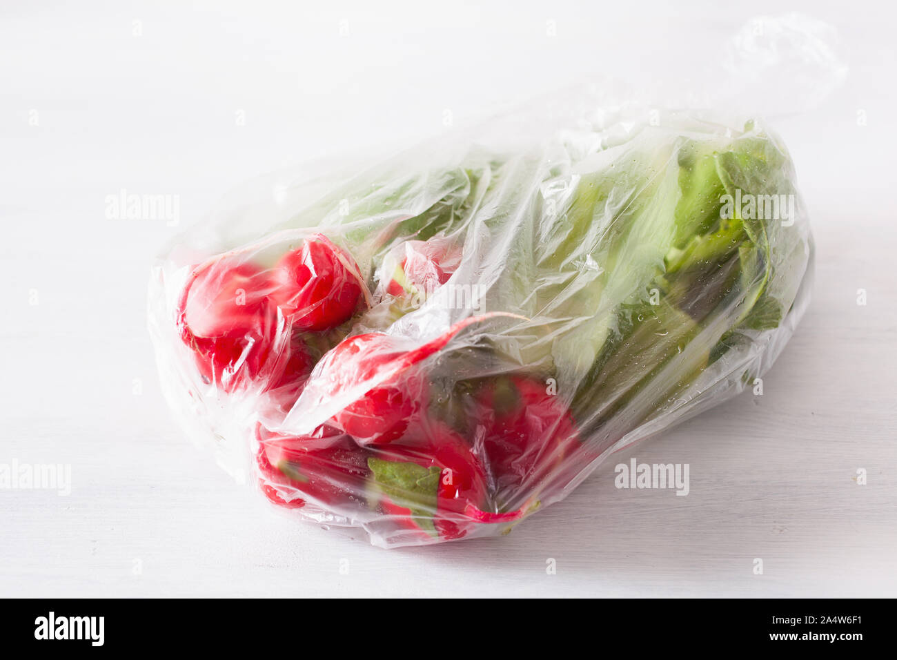 single use plastic packaging issue. radish vegetable in plastic bag ...