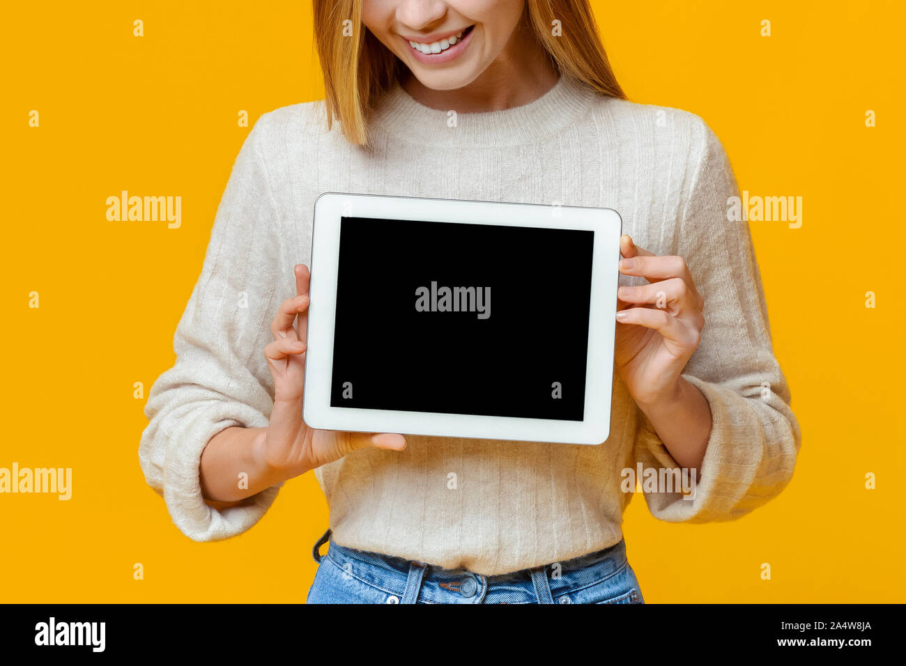 Young woman holding digital tab with black blank screen Stock Photo - Alamy