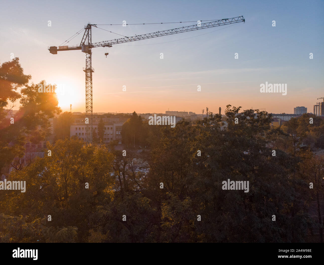 construction building site crane on sunset Stock Photo - Alamy