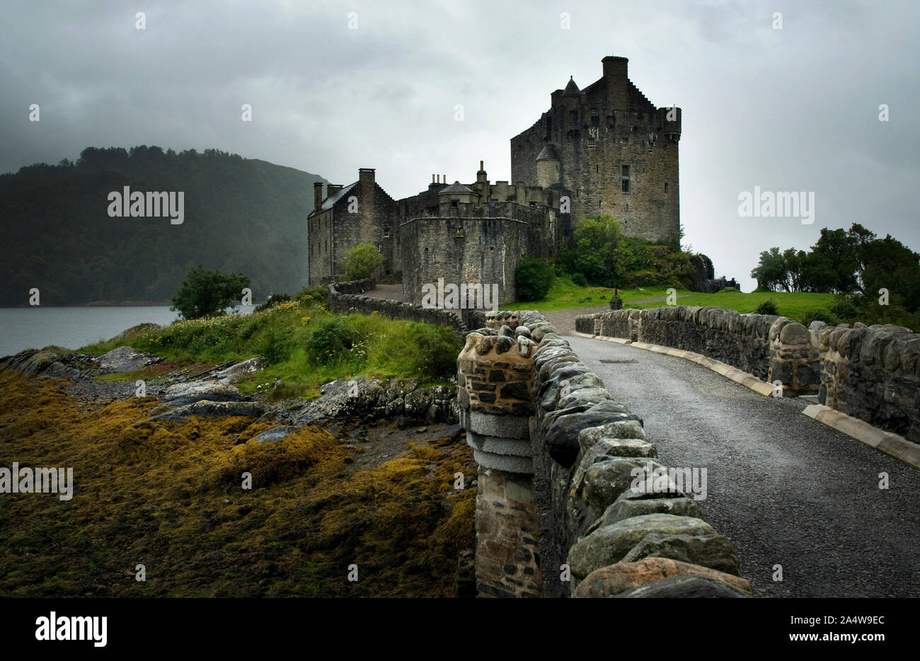 Famous castle of Eliean Donan in Scotland with cloudy sky Stock Photo ...