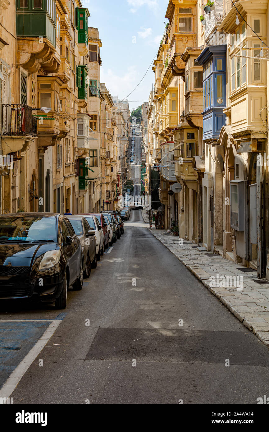 Typical Valletta street architecture with traditional Maltese wooden ...