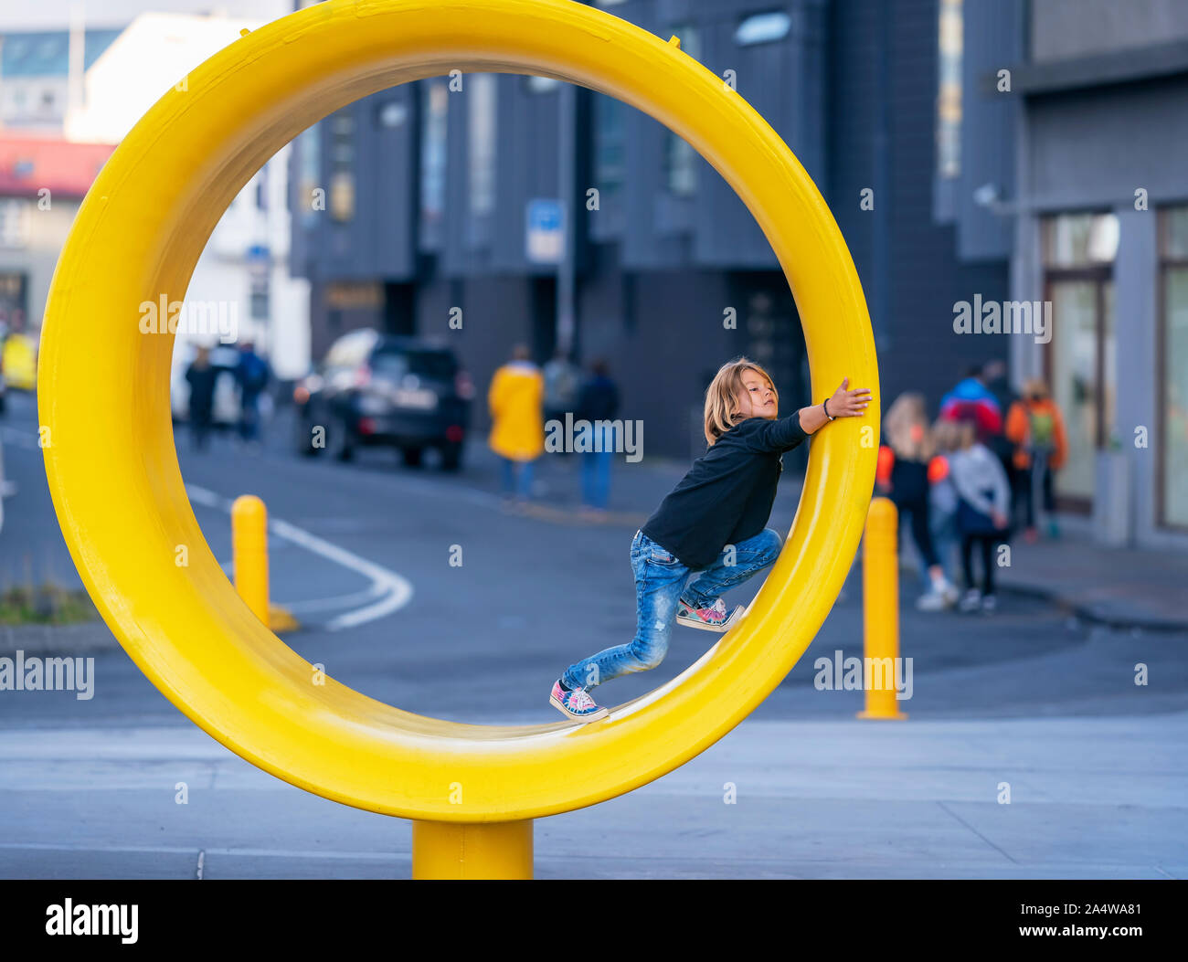 Child climbing on circular statue, Menningarnott celebration, Reykjavik ...