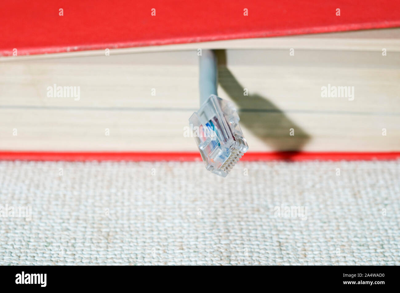 Cable connection coming from old book Stock Photo - Alamy