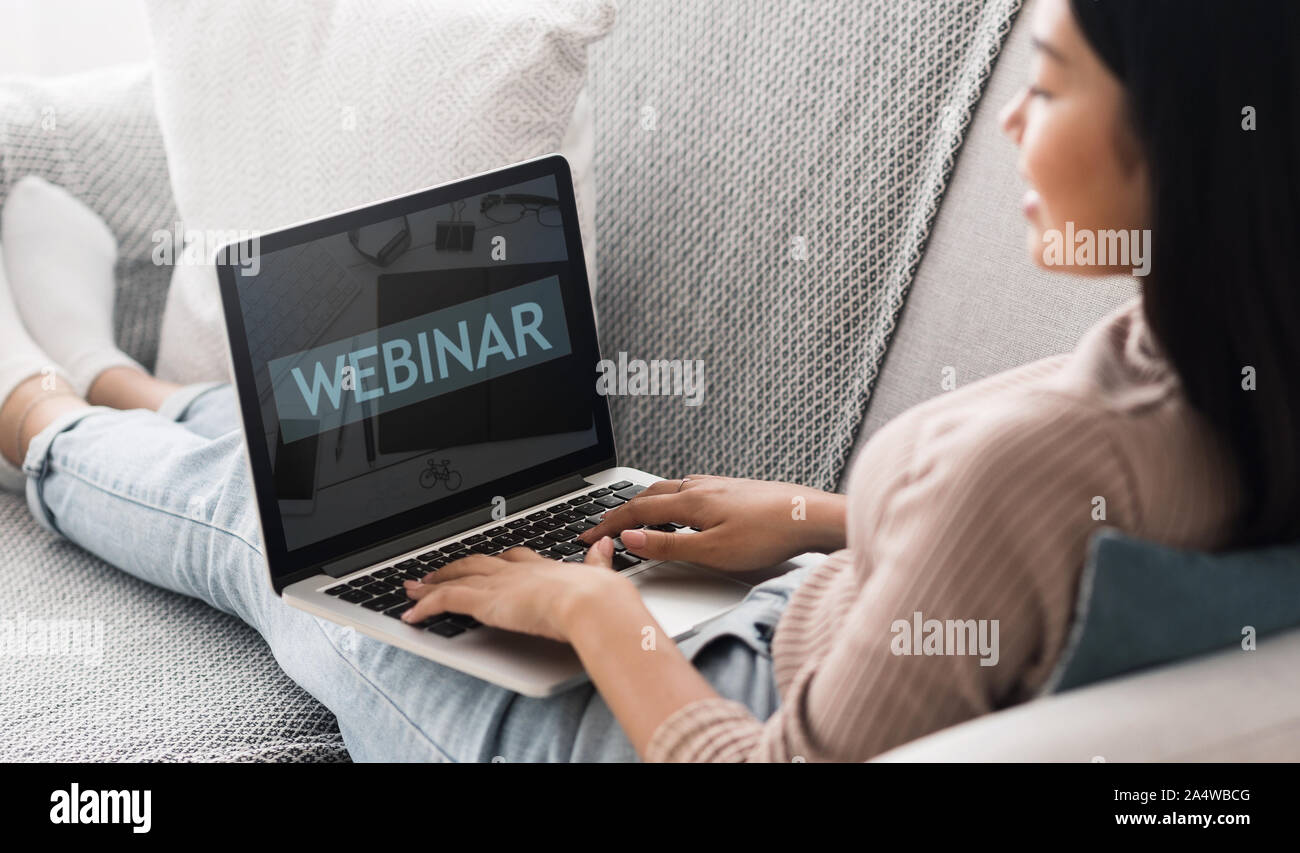 Student Girl Typing on Laptop with text on screen Stock Photo - Alamy