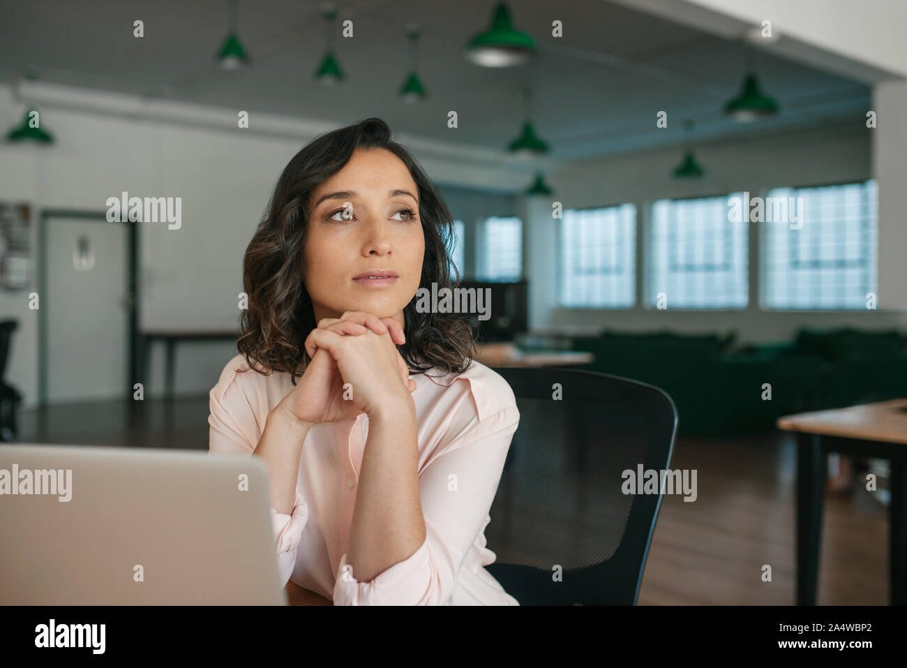 Business thinking woman computer hi-res stock photography and images ...