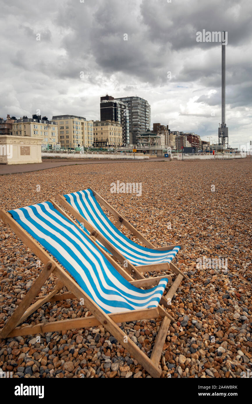 deck chairs on empty dull beach Stock Photo - Alamy