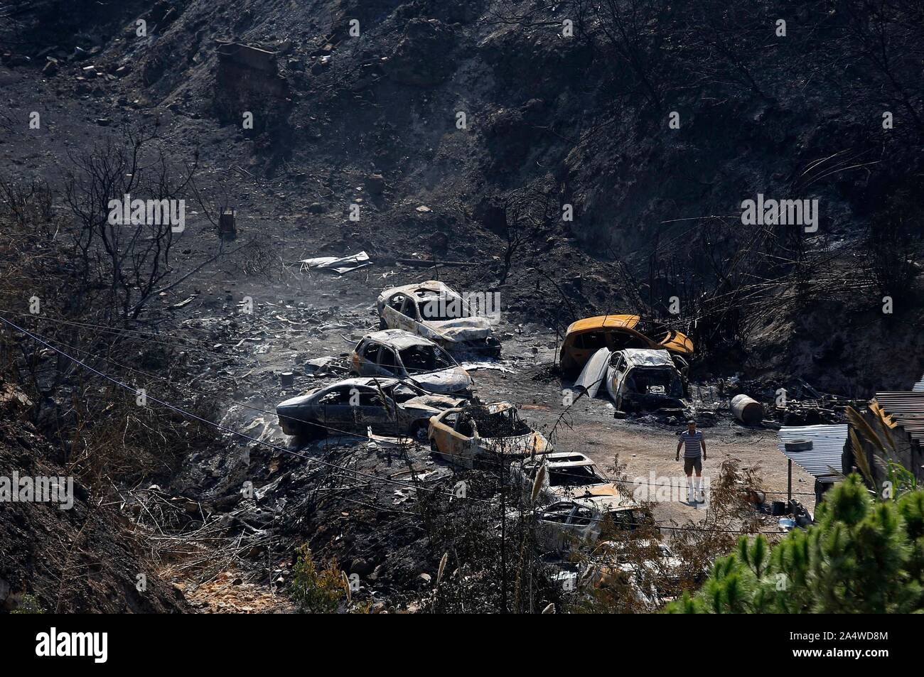 Beirut, Lebanon. 16th Oct, 2019. Destroyed cars are seen after a fire ...