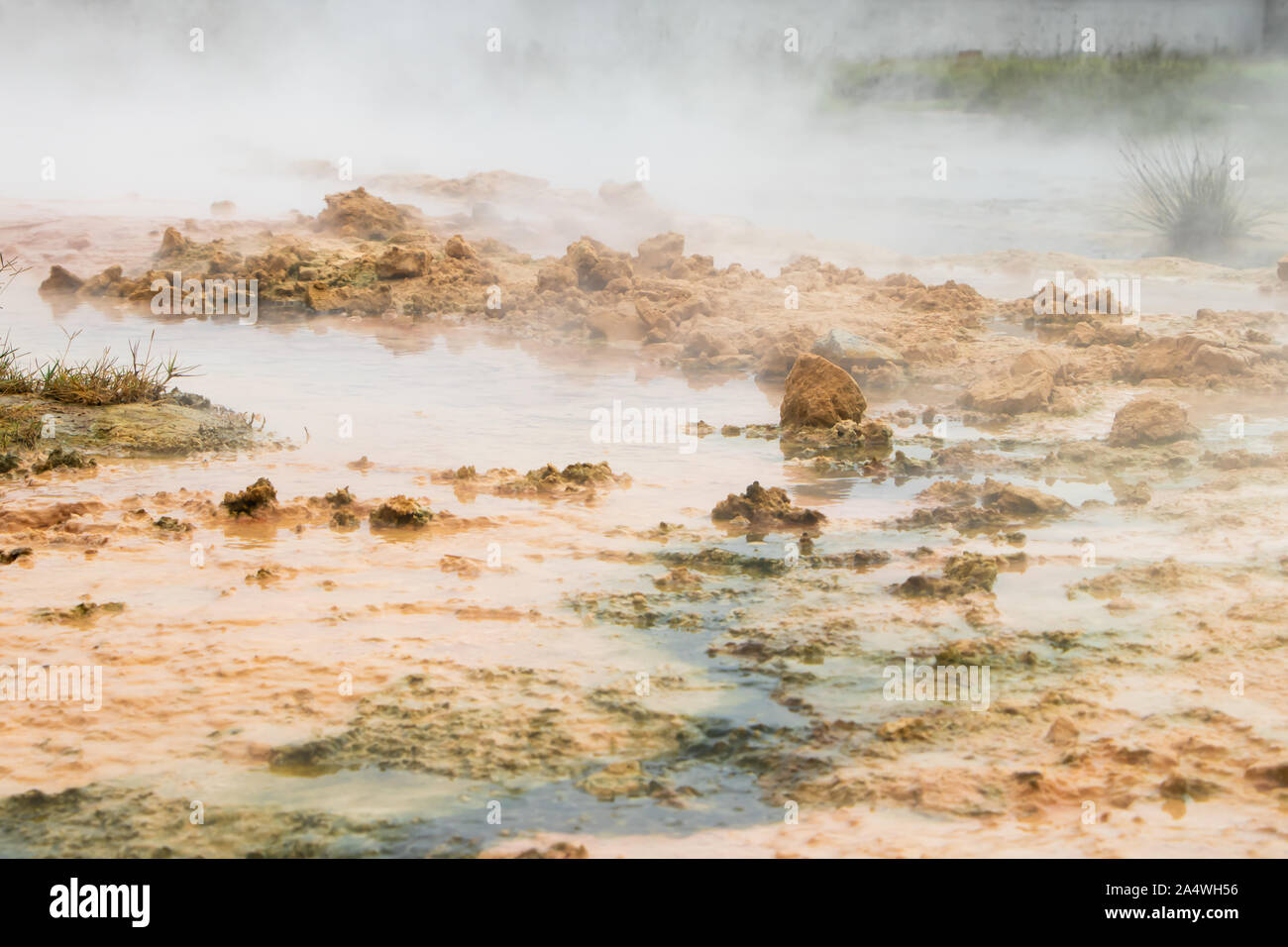 Hot mineral water over 75°C and the colorful earth Stock Photo - Alamy