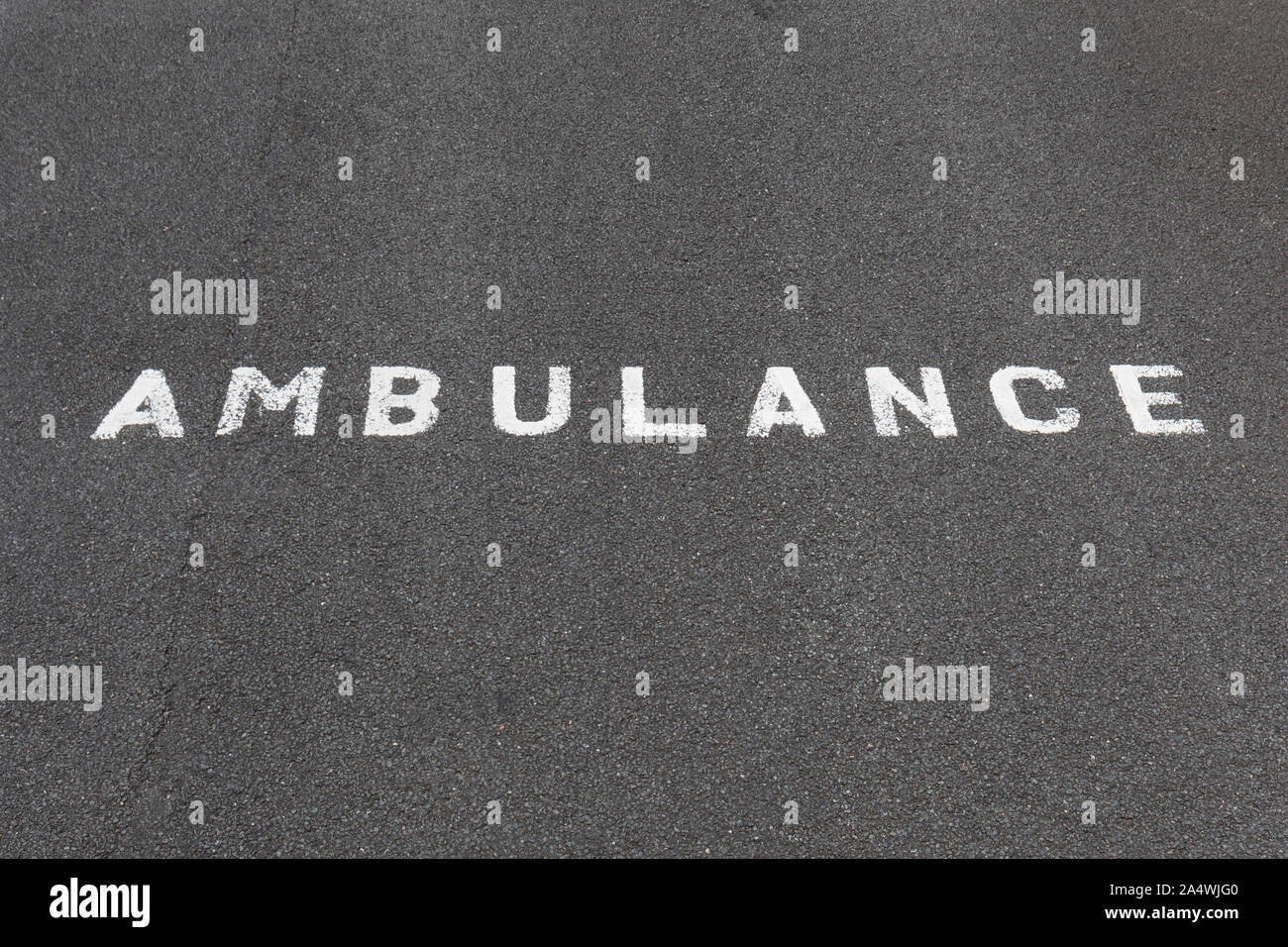 Word Ambulance written on an asphalt road Stock Photo - Alamy