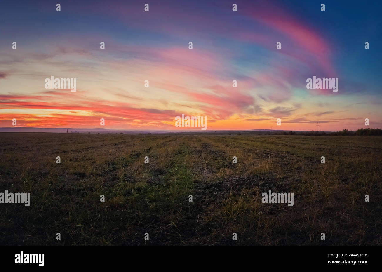 Majestic autumn sunset over a countryside open field. Soft and colorful ...