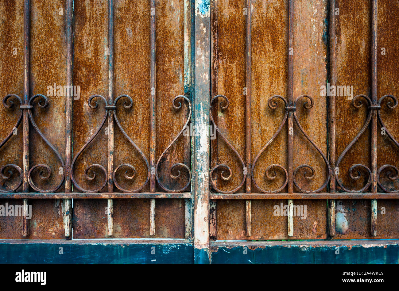 rusty gate design on closed and abandonned property Stock Photo - Alamy